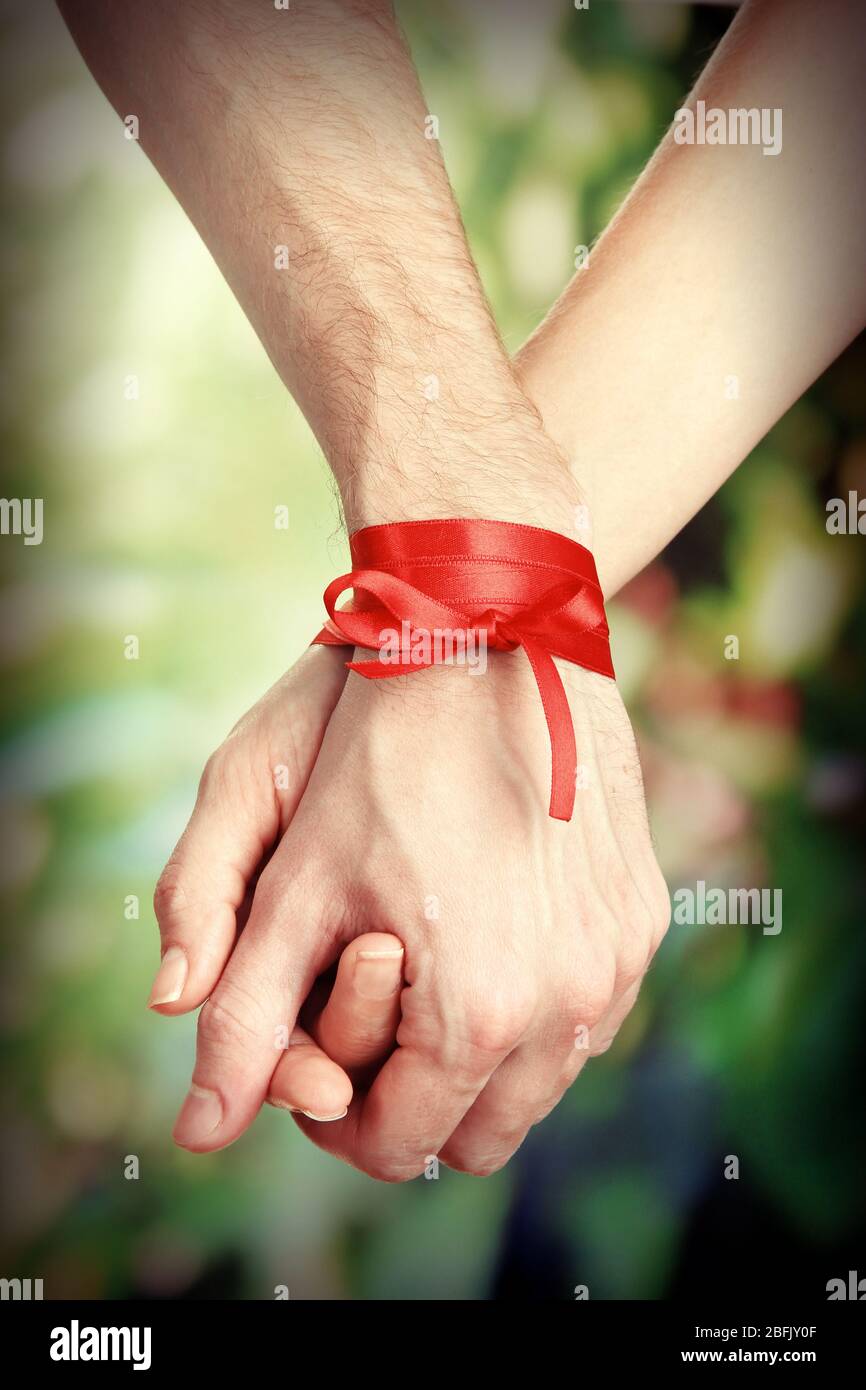 Mans hand holding womans arm hi-res stock photography and images - Alamy