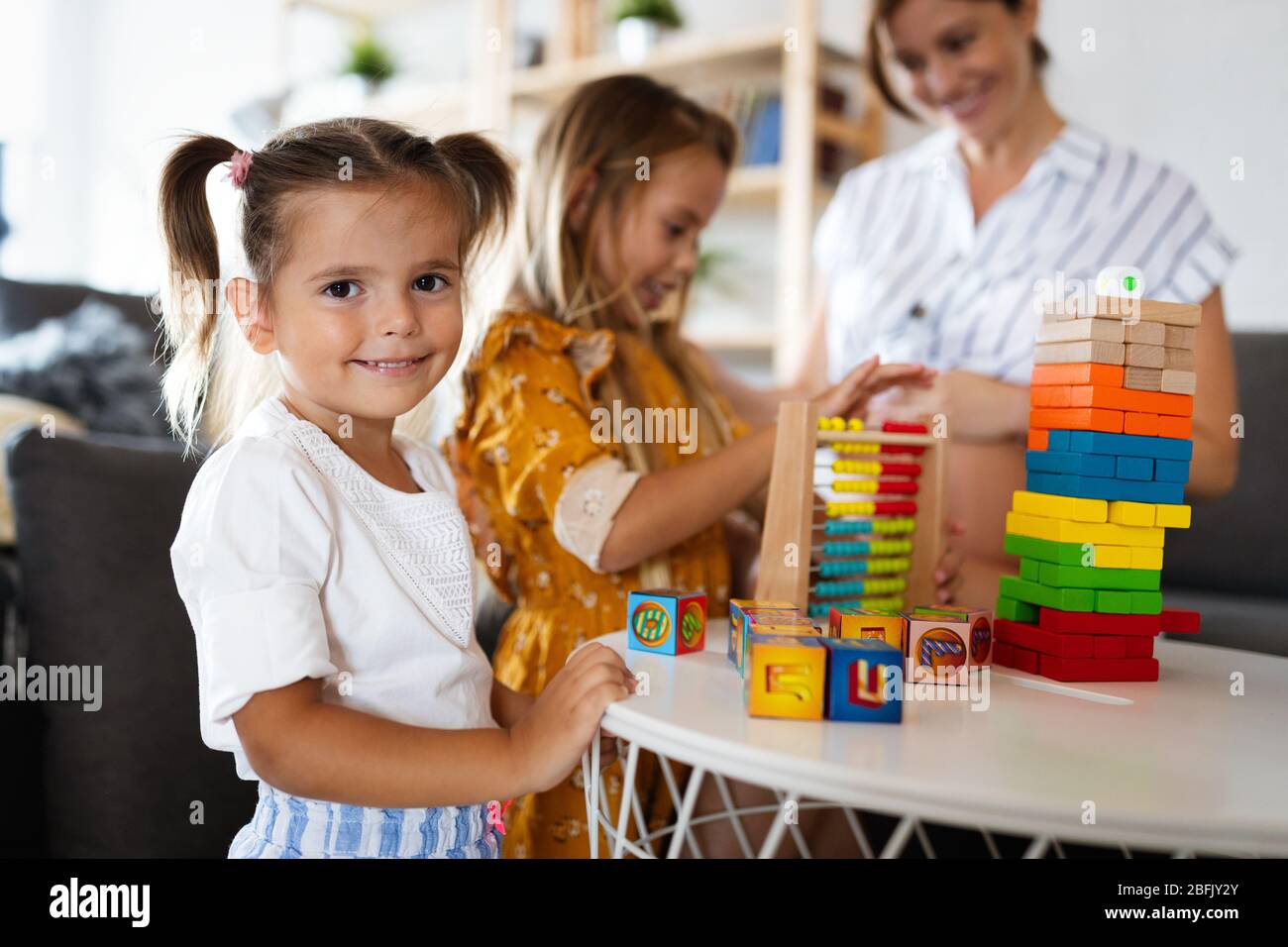 Happy family having fun times at home Stock Photo - Alamy