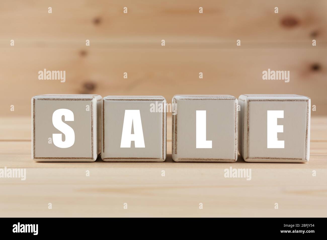 SALE spelled in wooden blocks Stock Photo - Alamy