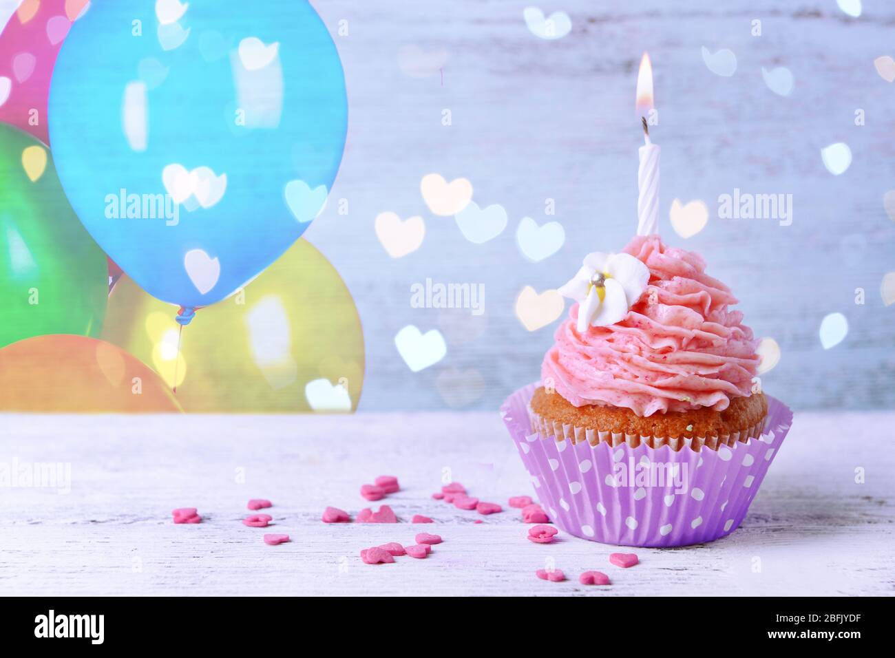 Delicious birthday cupcake on wooden table Stock Photo - Alamy