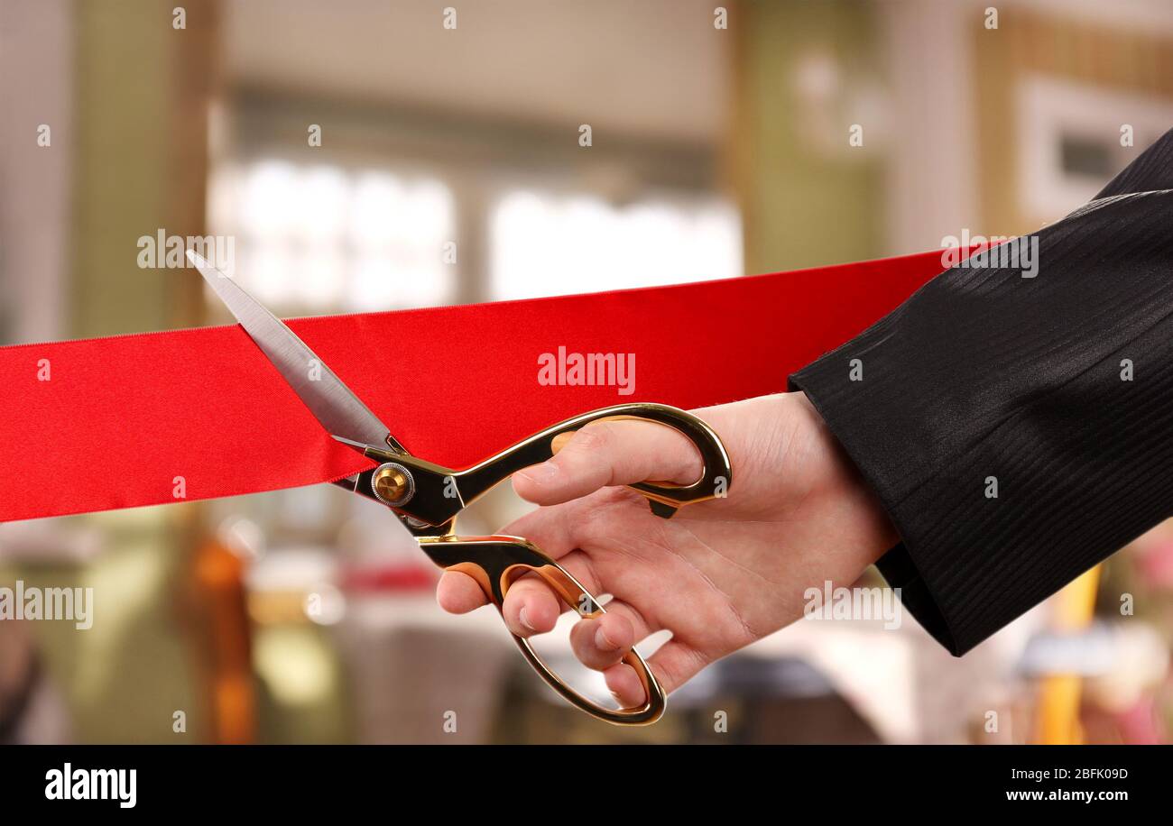 Grand opening, cutting red ribbon Stock Photo - Alamy
