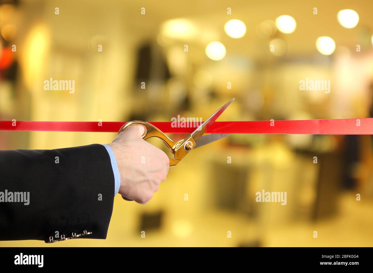 Grand opening, cutting red ribbon Stock Photo - Alamy