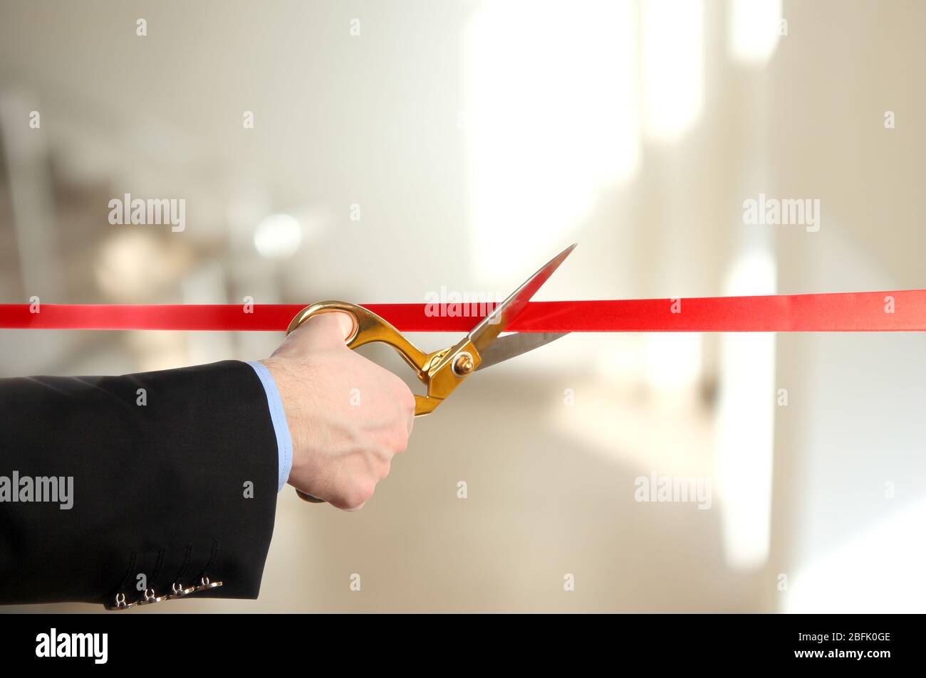 Grand opening, cutting red ribbon Stock Photo - Alamy