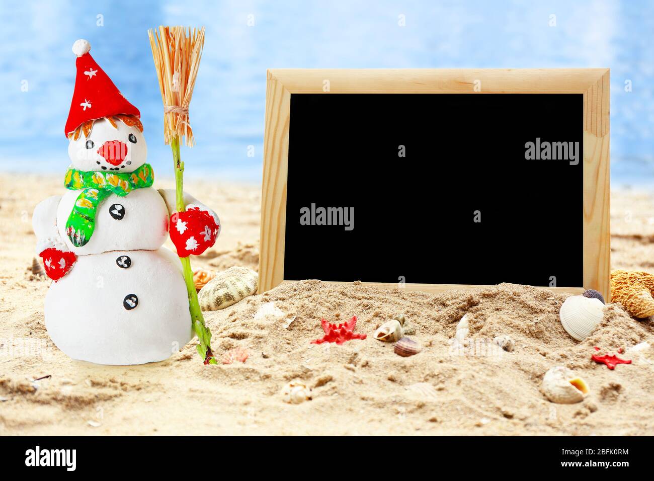 Snowman made sand on beach hi-res stock photography and images - Alamy