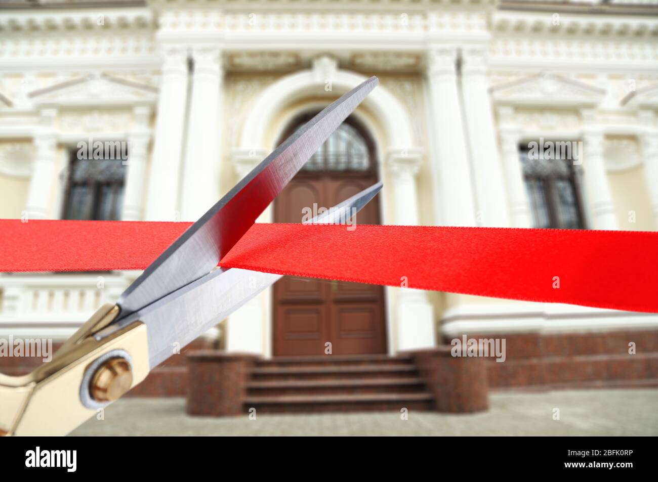 Grand opening, cutting red ribbon Stock Photo - Alamy