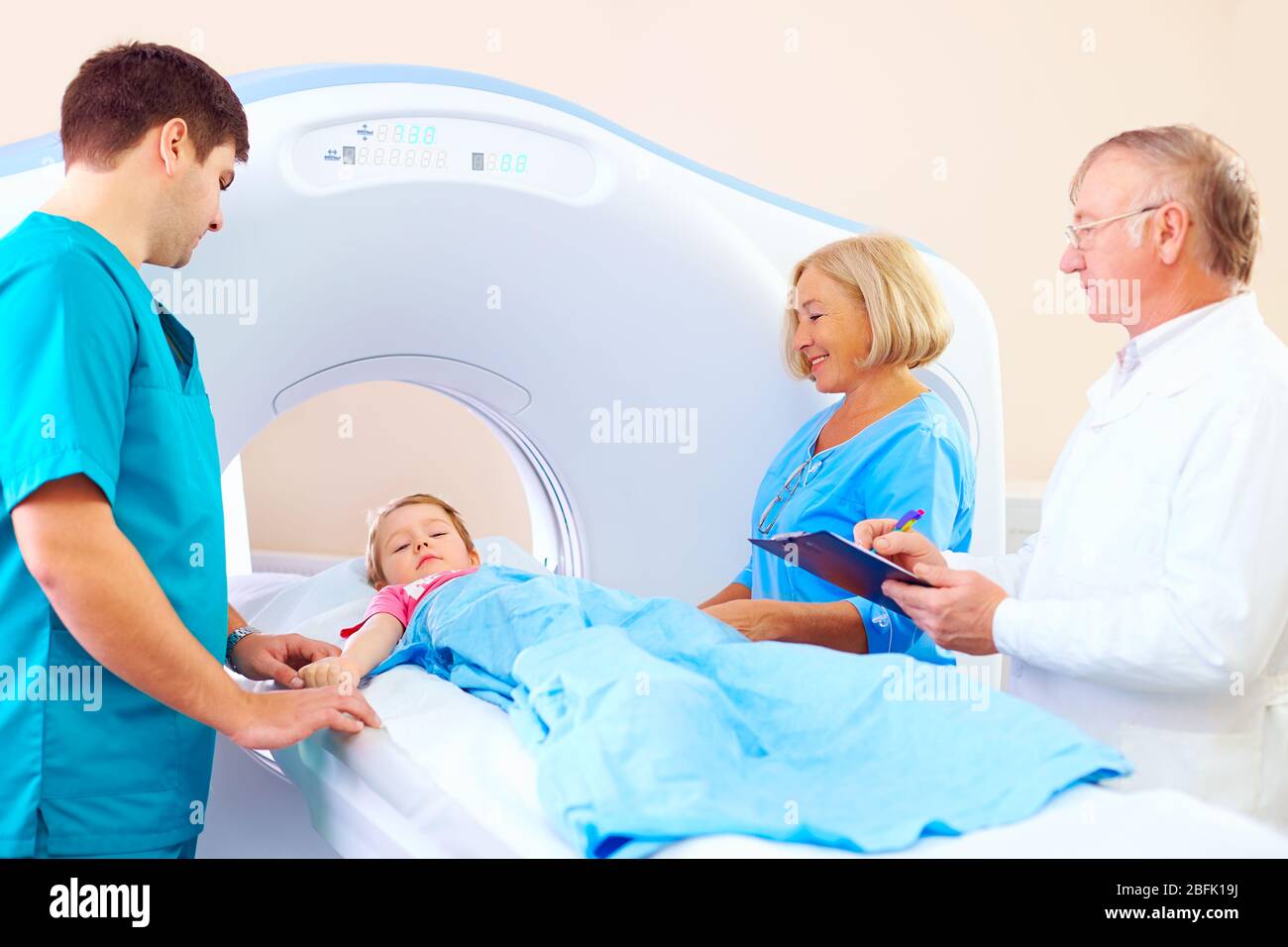 little patient kid among medical staff ready for ct scanning Stock ...