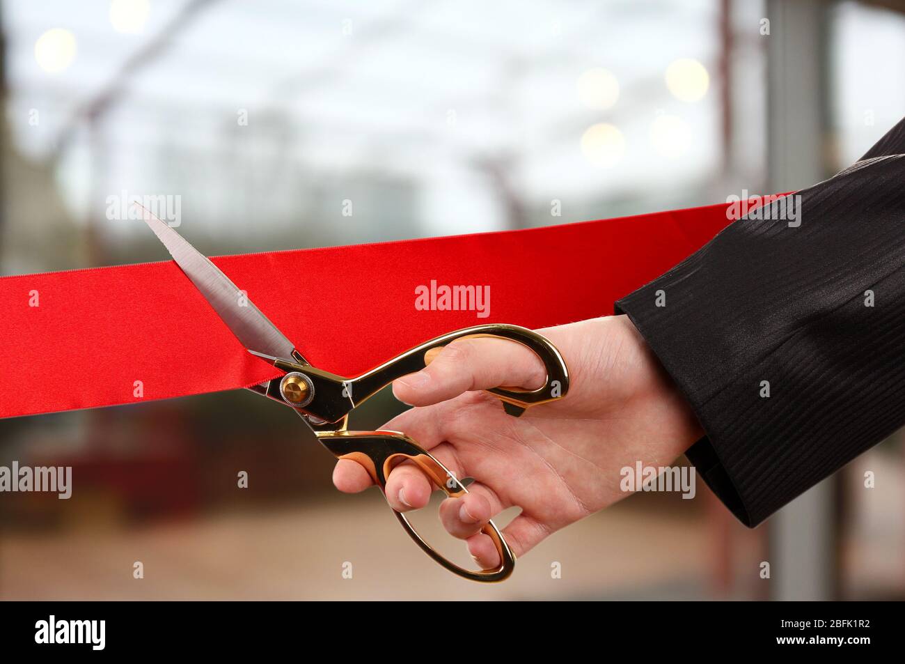 Grand opening, cutting red ribbon Stock Photo - Alamy