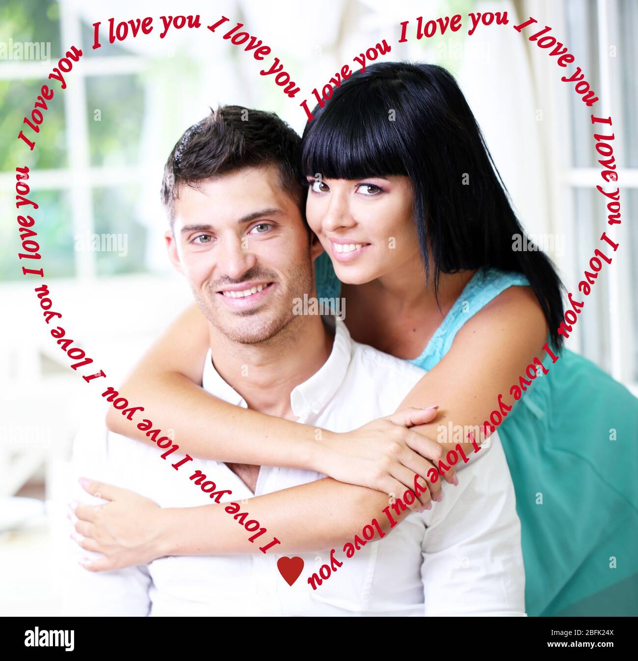 Beautiful young romantic couple and heart-shaped frame Stock Photo - Alamy
