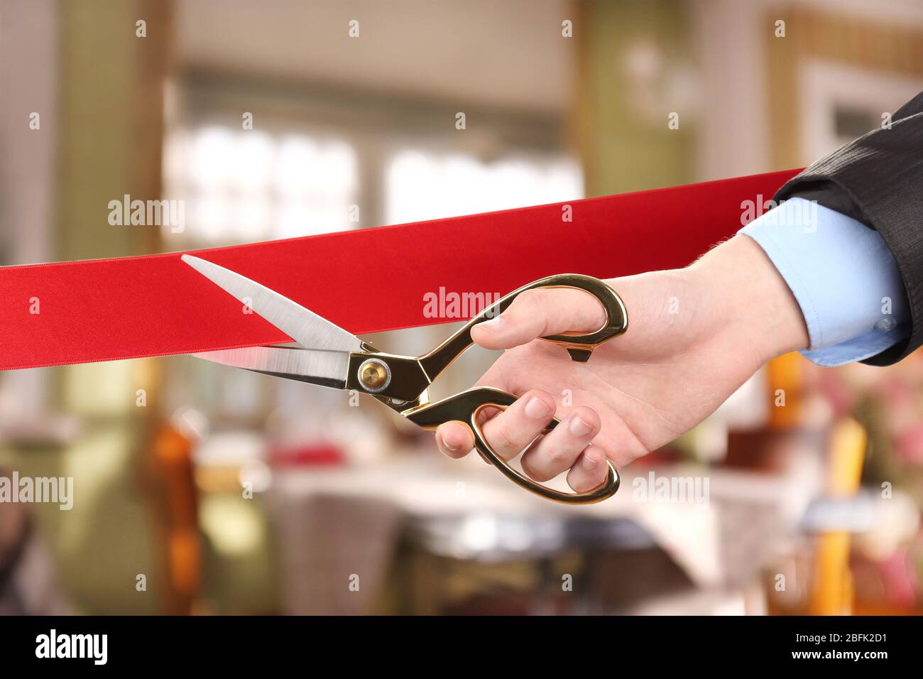 Grand opening, cutting red ribbon Stock Photo - Alamy