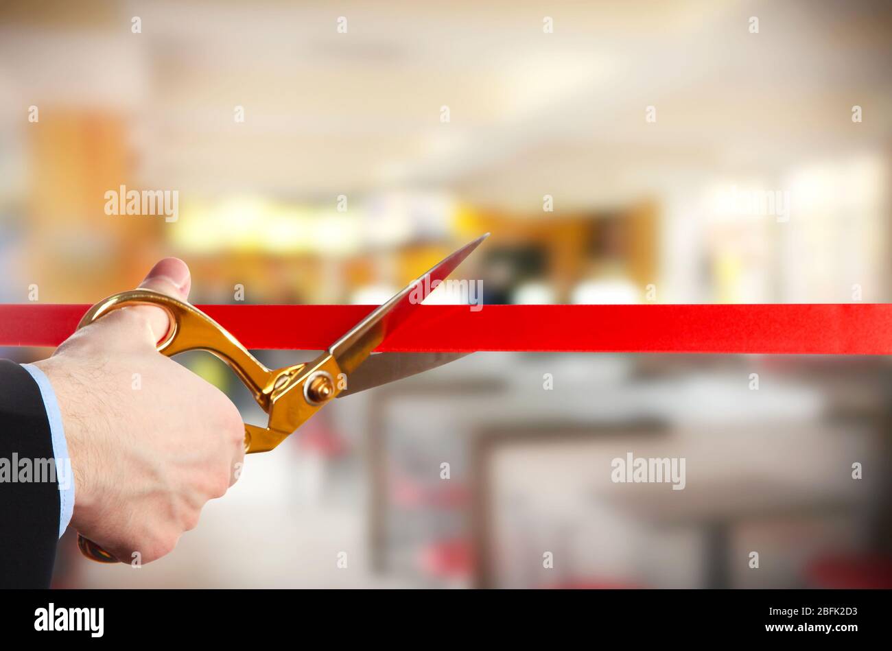 Grand opening, cutting red ribbon Stock Photo - Alamy