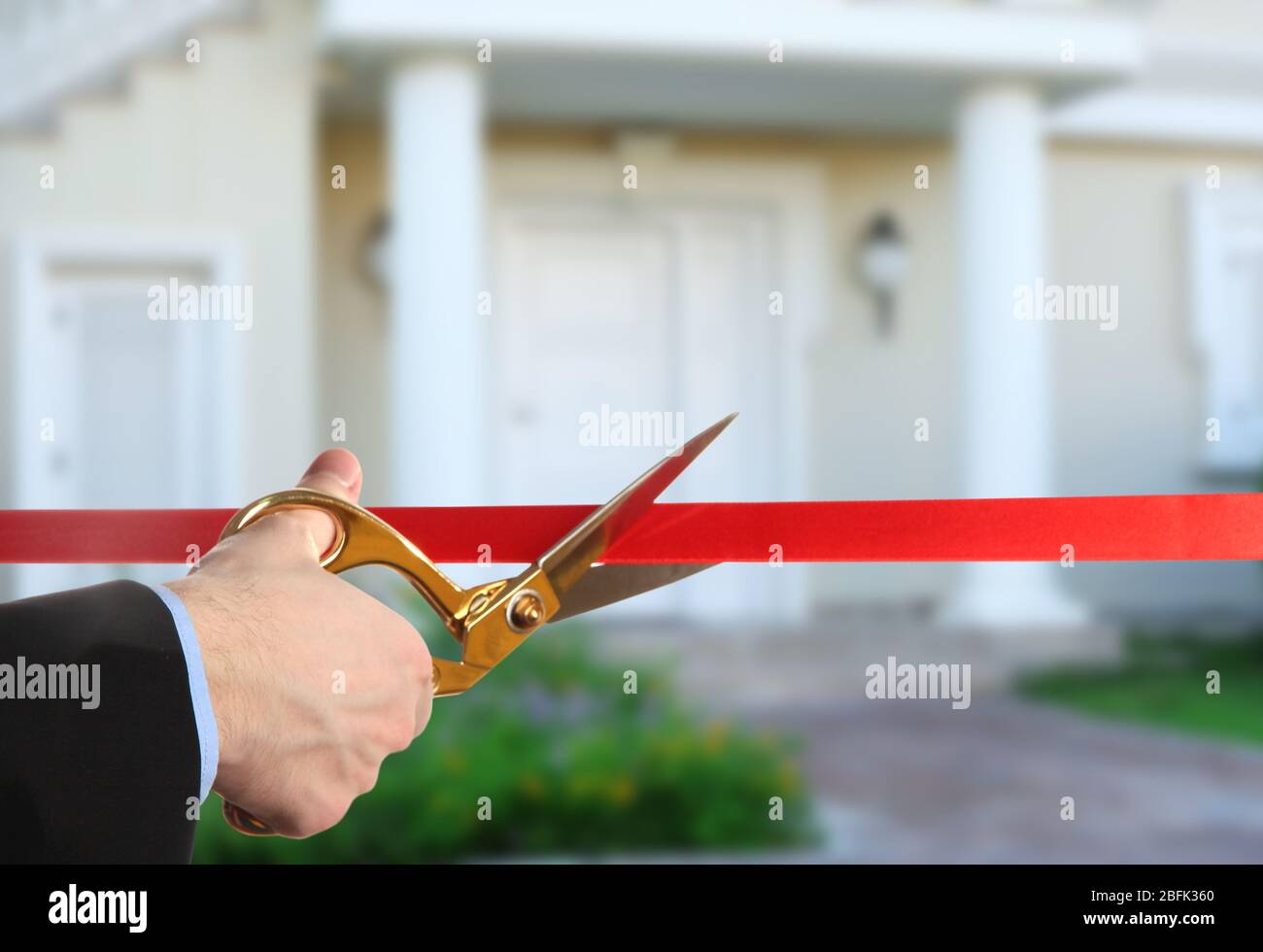 Grand opening, cutting red ribbon Stock Photo - Alamy