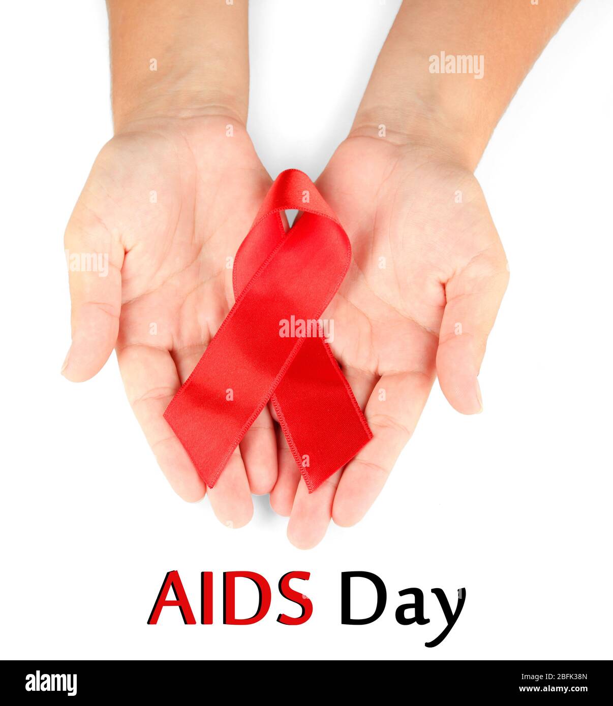 AIDS ribbon in hands isolated on white Stock Photo - Alamy