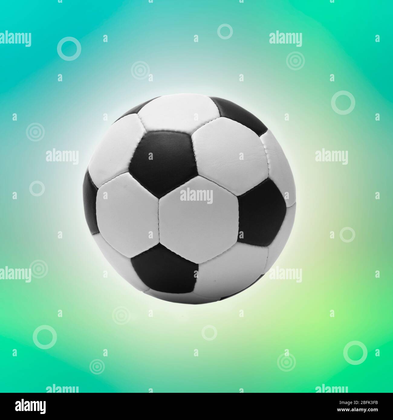 Football ball on bright green background, sports poster Stock Photo - Alamy