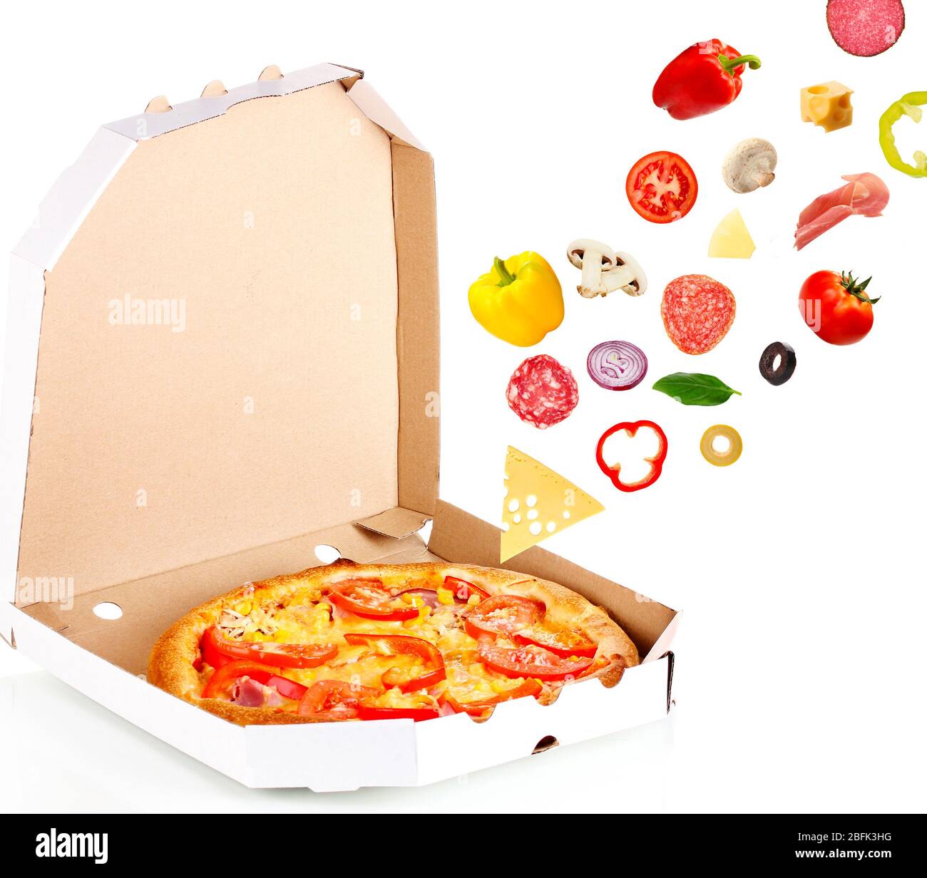 Tasty pizza in box and falling ingredients isolated on white Stock ...