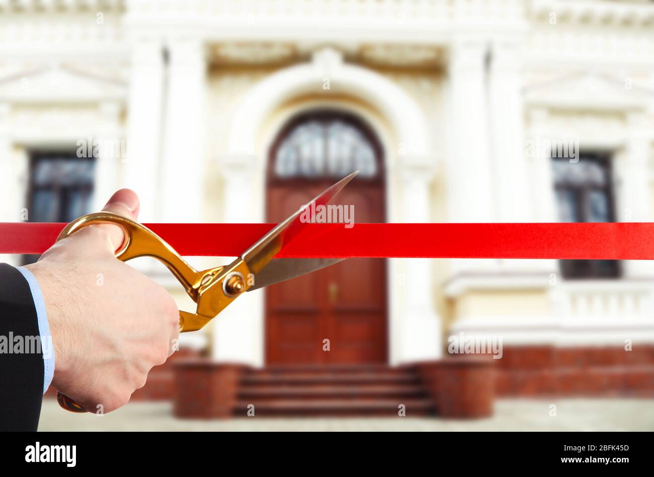 Grand opening, cutting red ribbon Stock Photo - Alamy