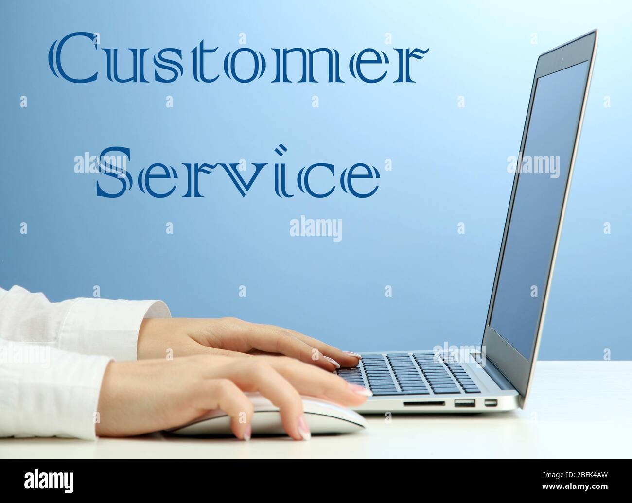 Female hands typing on laptop and Customer Service text on background ...