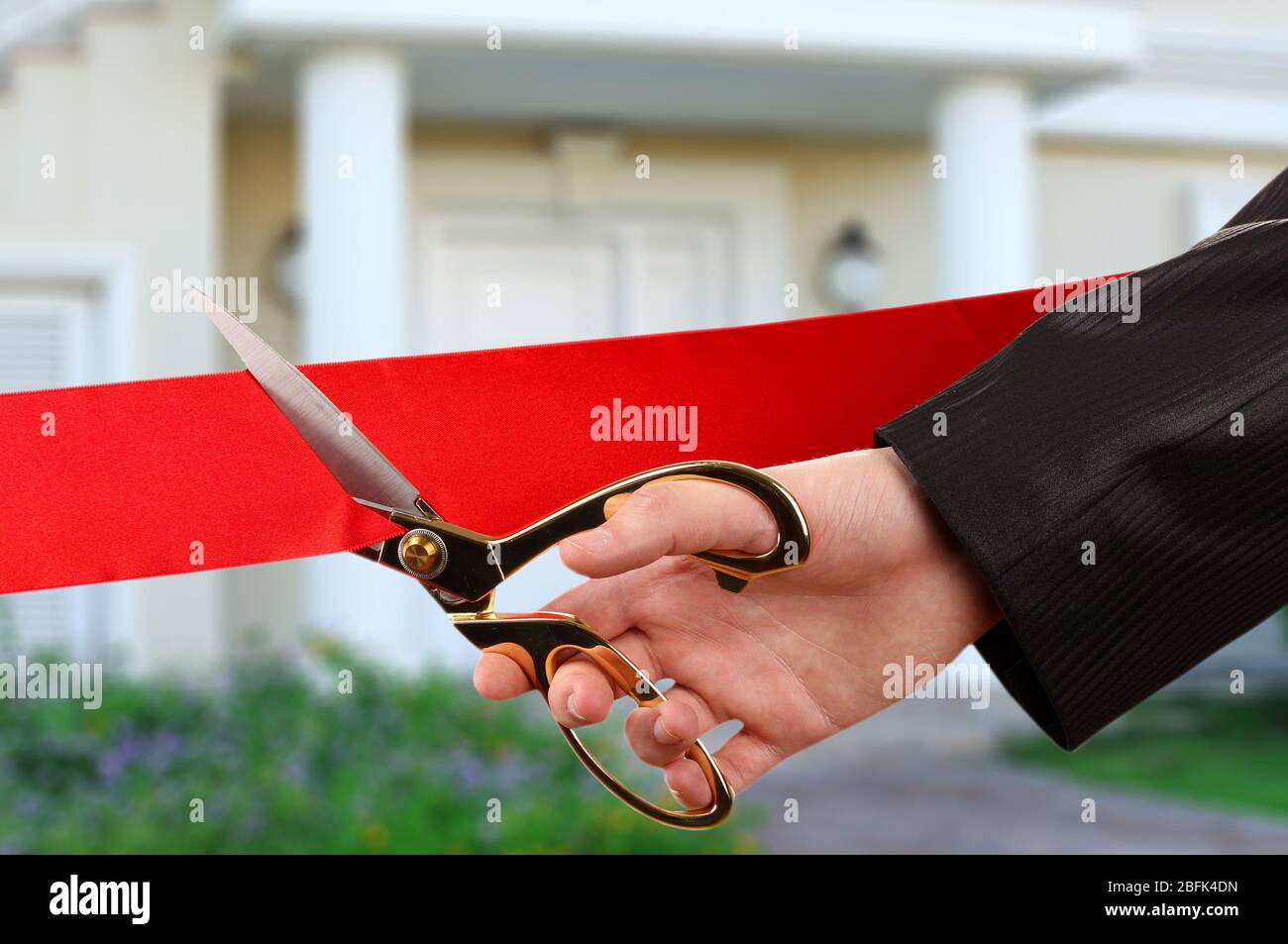 Grand opening, cutting red ribbon Stock Photo - Alamy