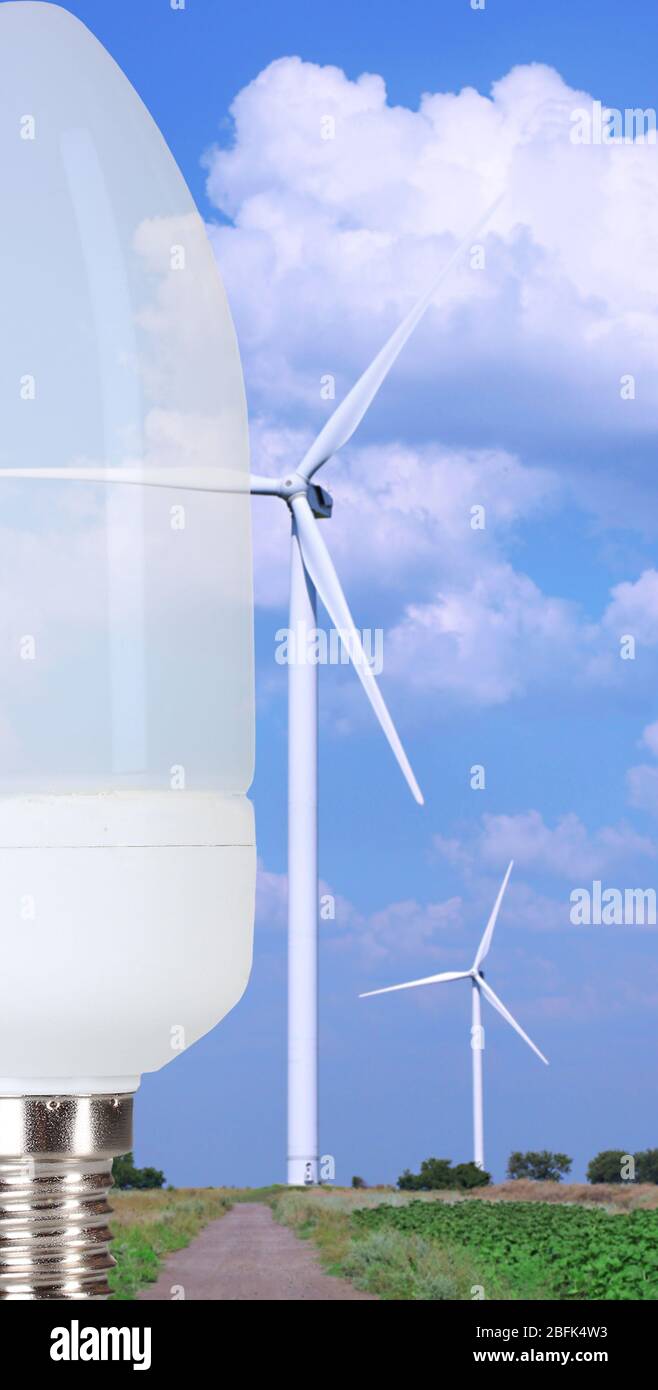 Light bulb on windmills field background Stock Photo - Alamy
