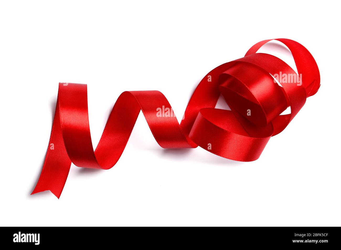 Shiny red ribbon isolated on white Stock Photo - Alamy