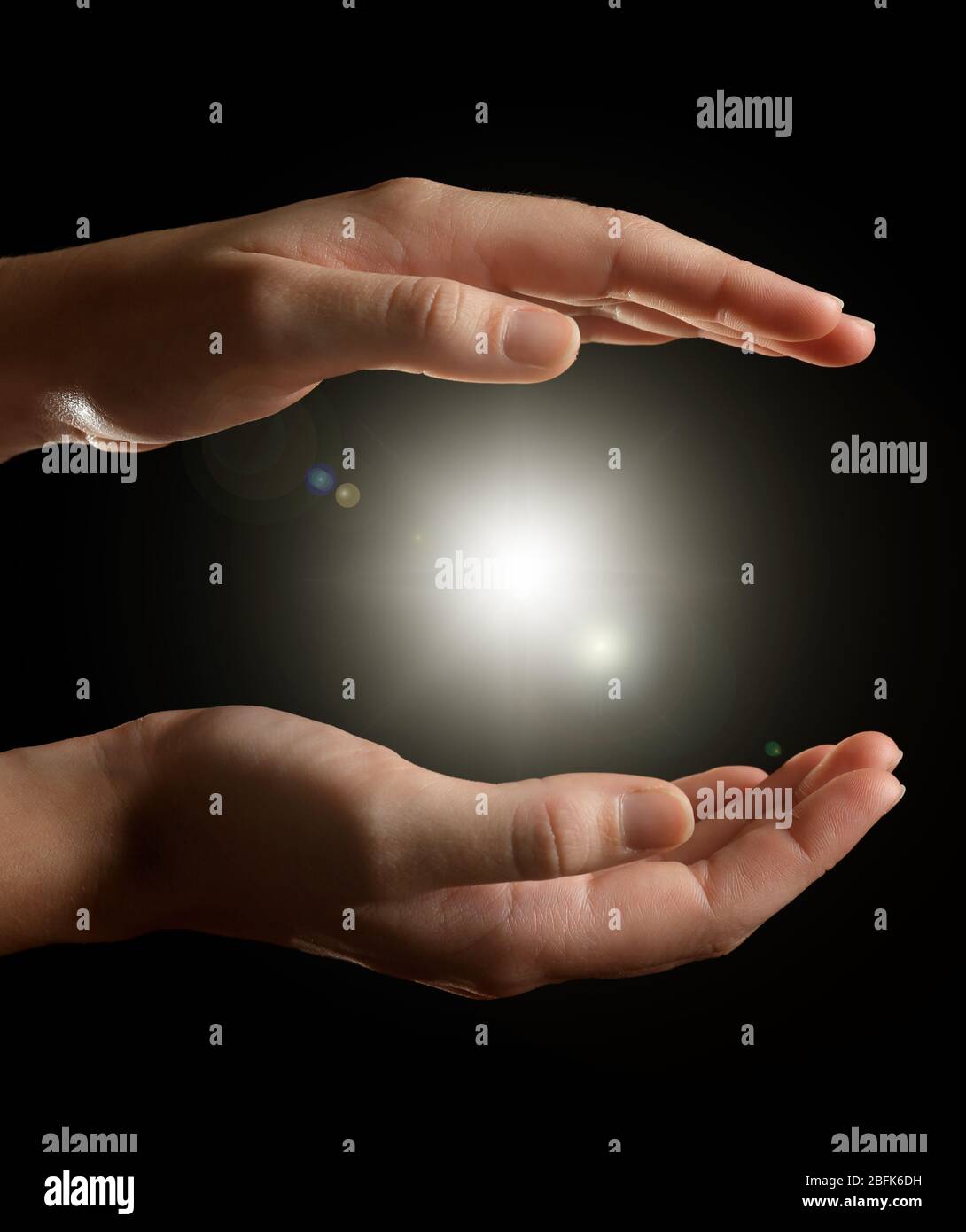 The light in young woman hands Stock Photo - Alamy