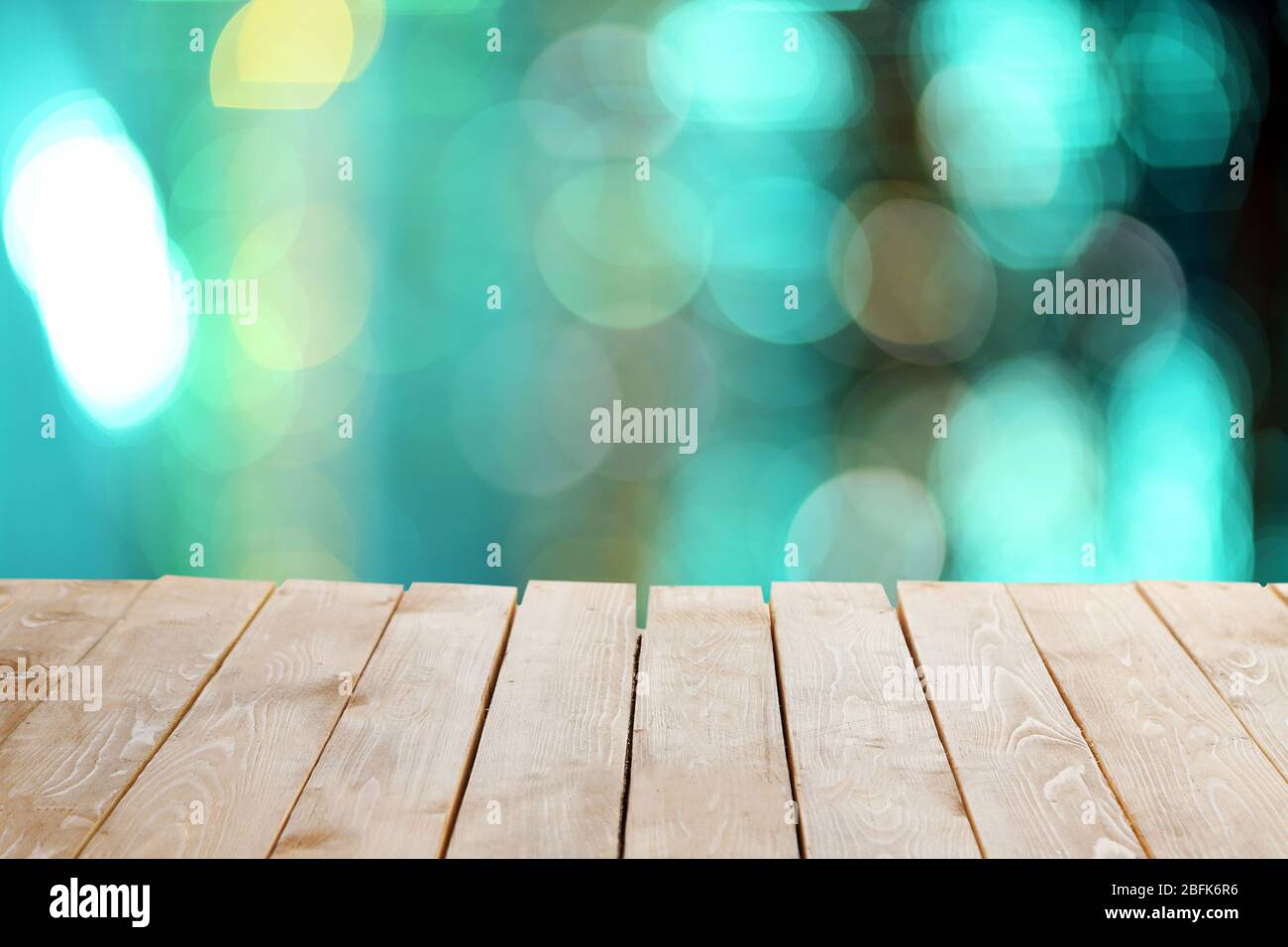 Wooden table with abstract blur background Stock Photo - Alamy