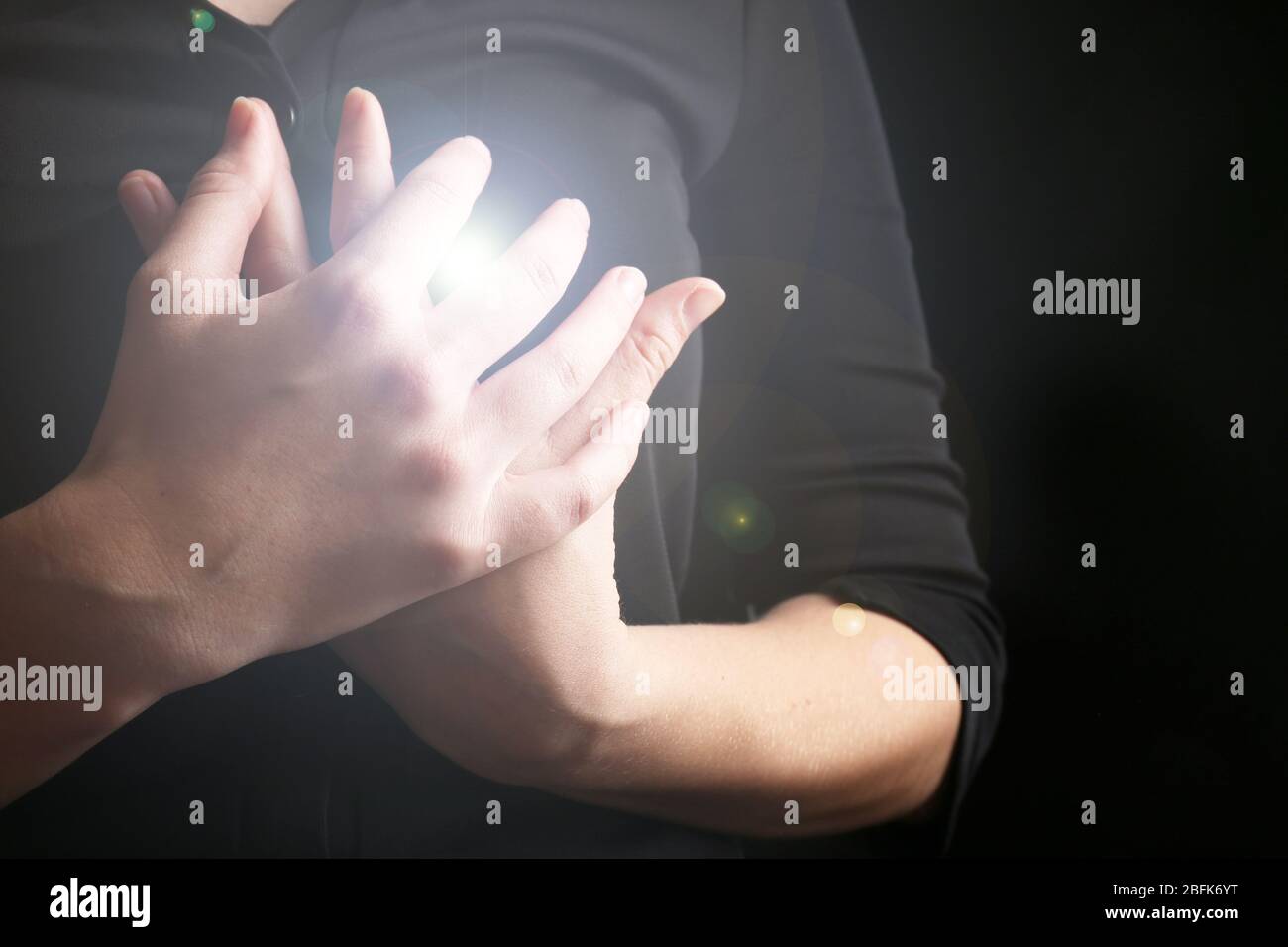 The light in young woman hands Stock Photo - Alamy