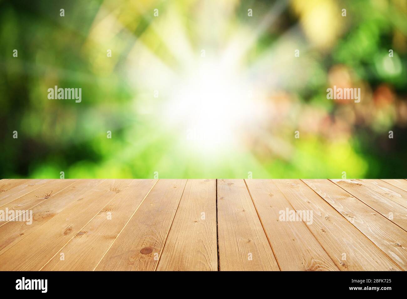 Wooden table with abstract blur background Stock Photo - Alamy