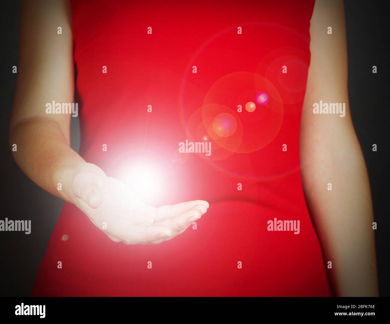 The light in young woman hand Stock Photo - Alamy
