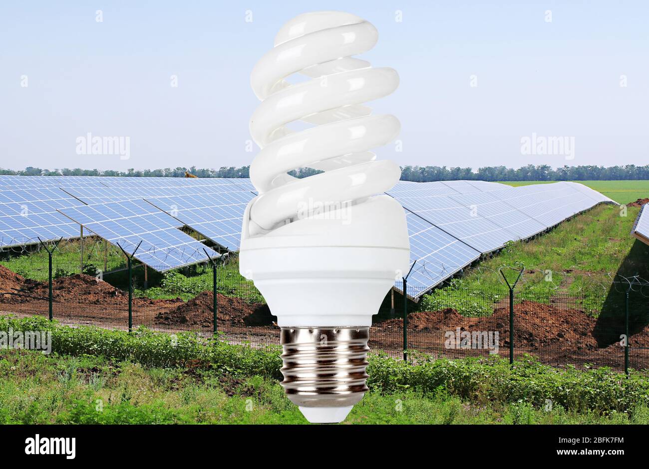 Light bulb on solar panels background Stock Photo - Alamy