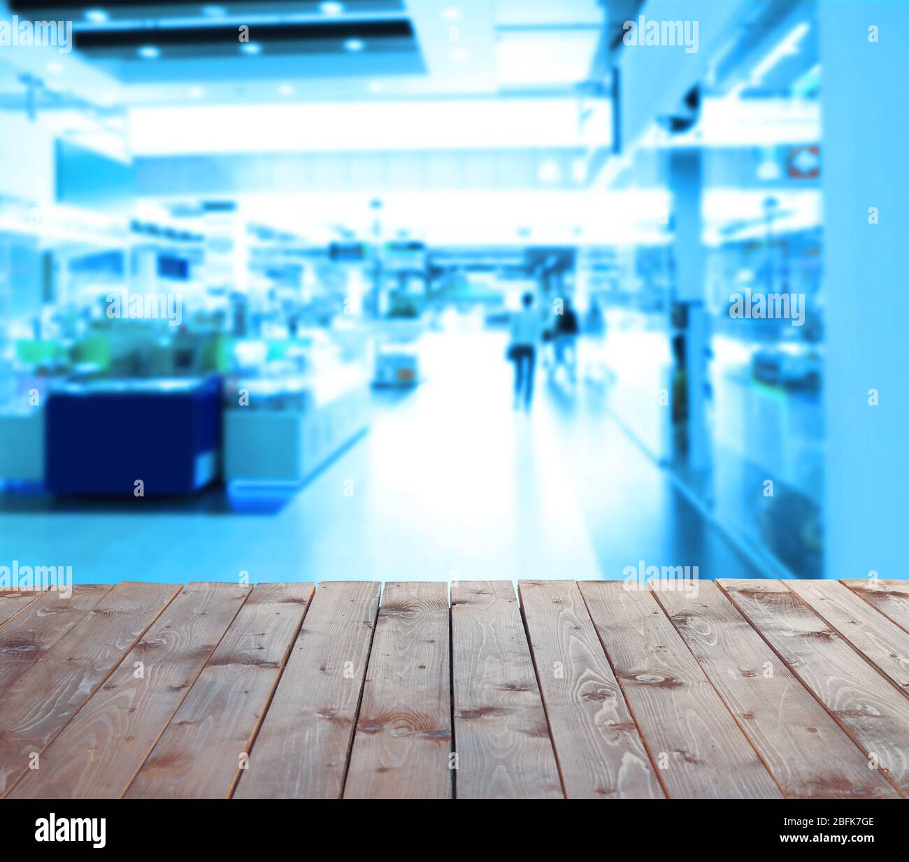 Wooden table with abstract blur background Stock Photo - Alamy