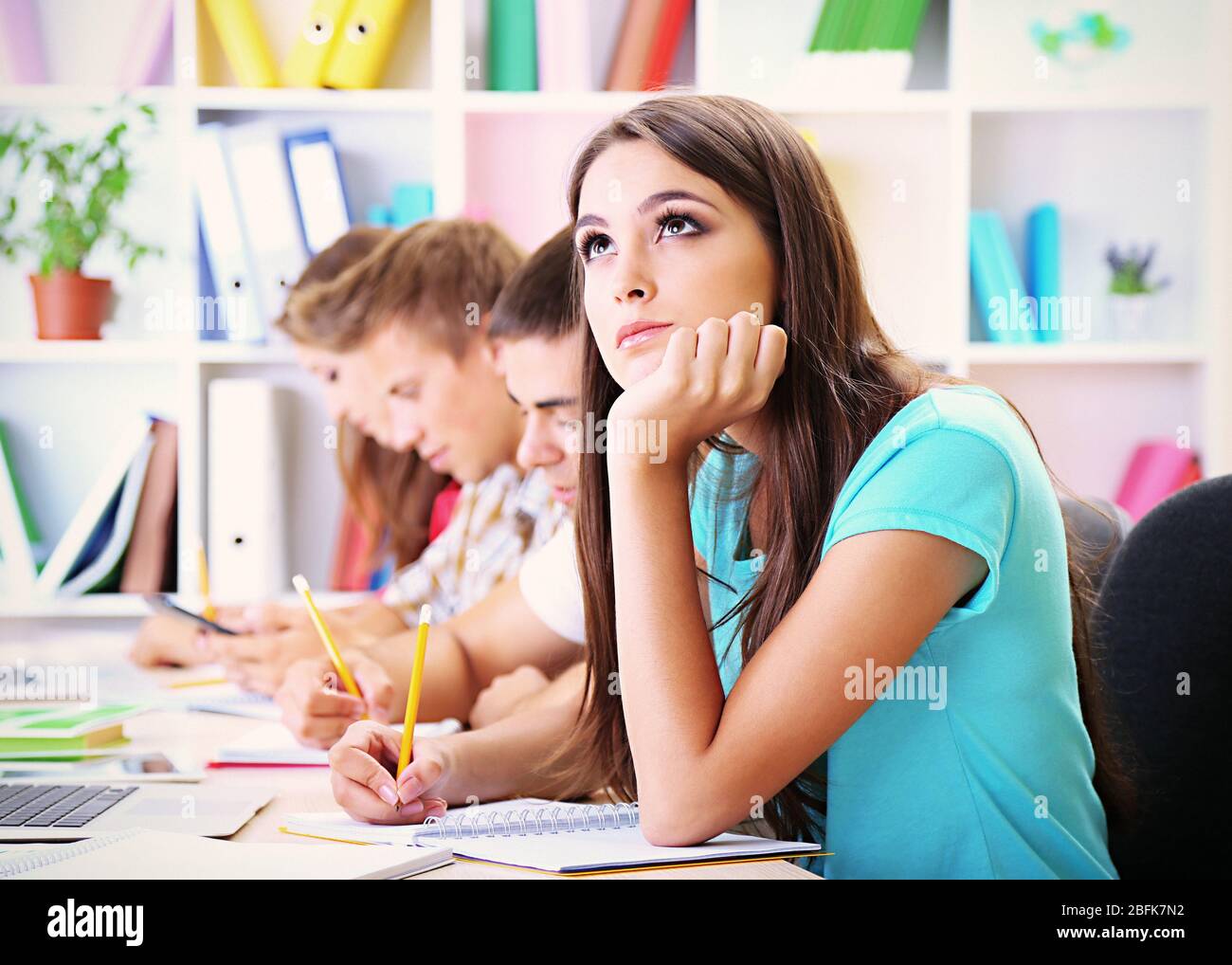 Young students sitting in classroom Stock Photo - Alamy