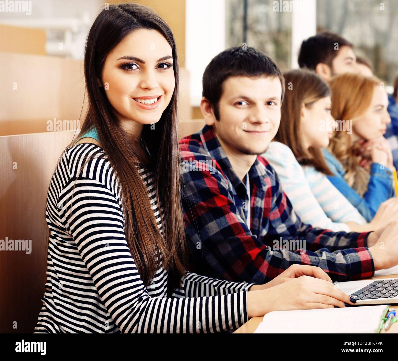 Group of students sitting in classroom Stock Photo - Alamy