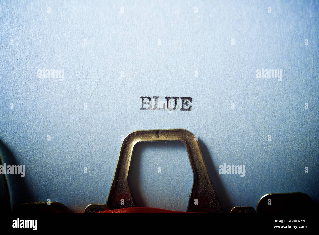 Blue word written on a paper Stock Photo - Alamy