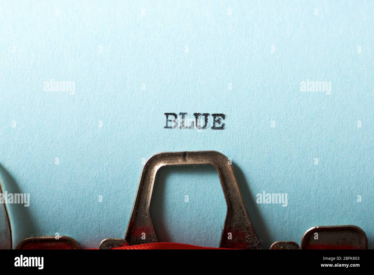 Blue word written on a paper Stock Photo - Alamy
