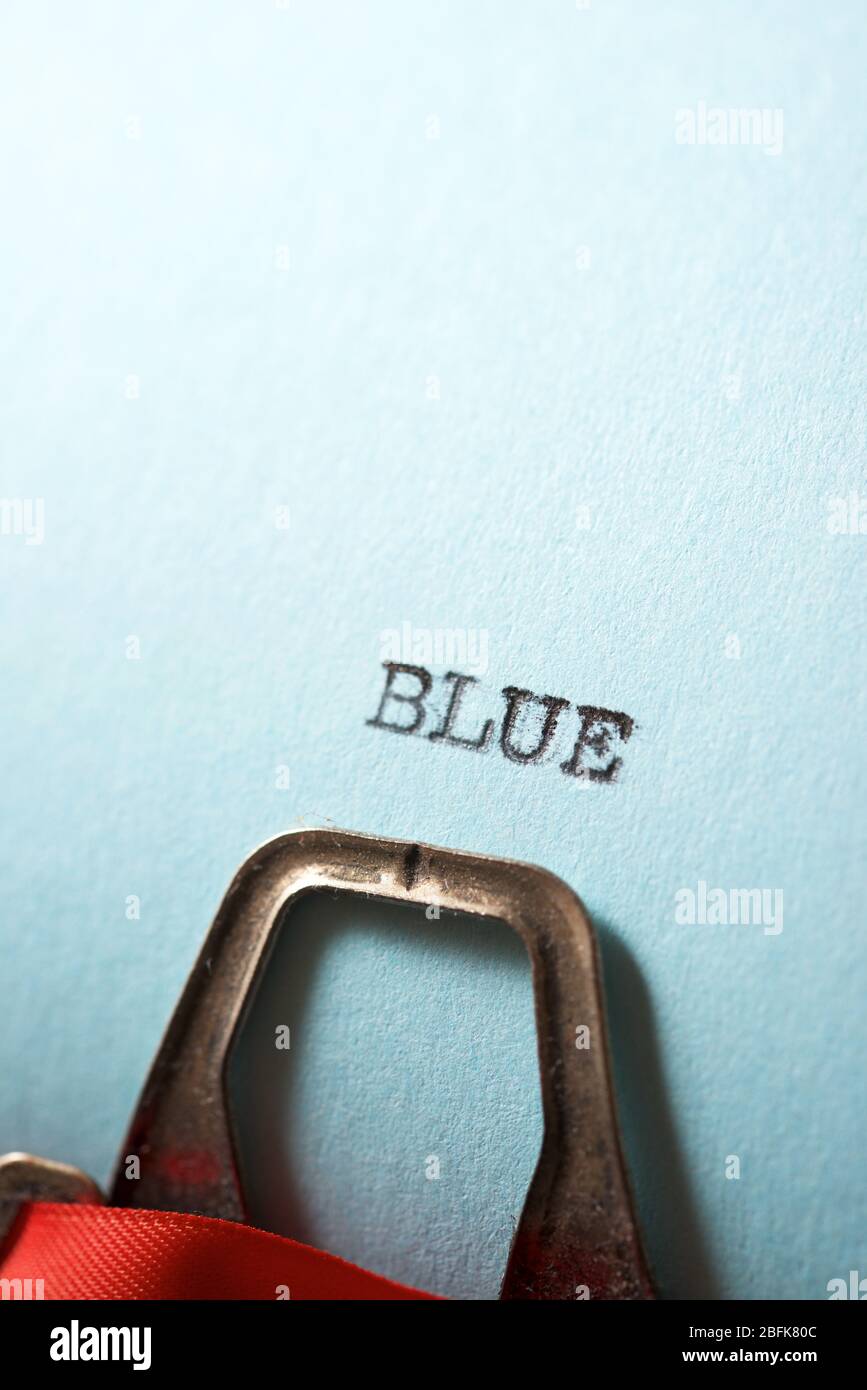 Blue word written on a paper Stock Photo - Alamy