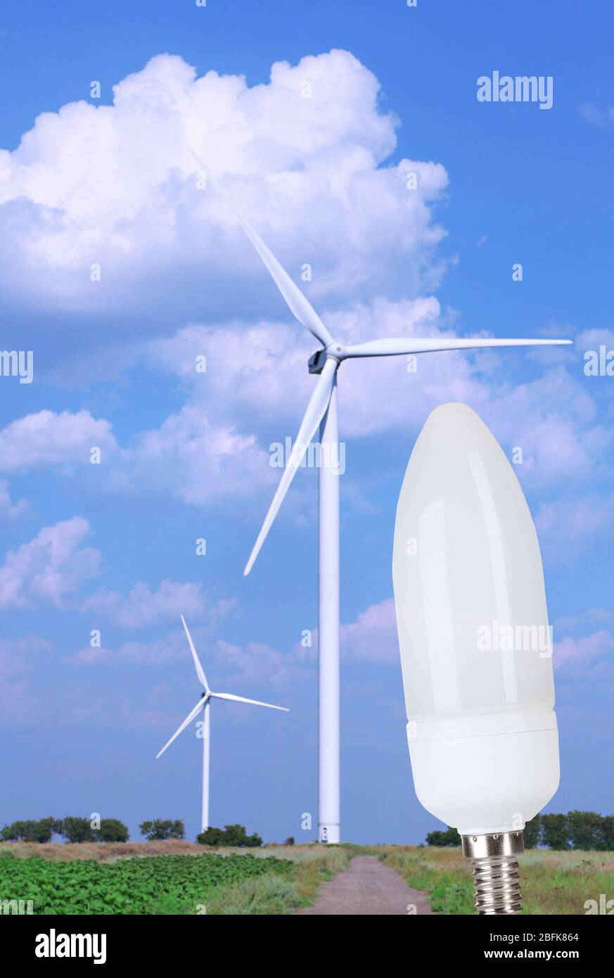 Light bulb on windmills field background Stock Photo - Alamy
