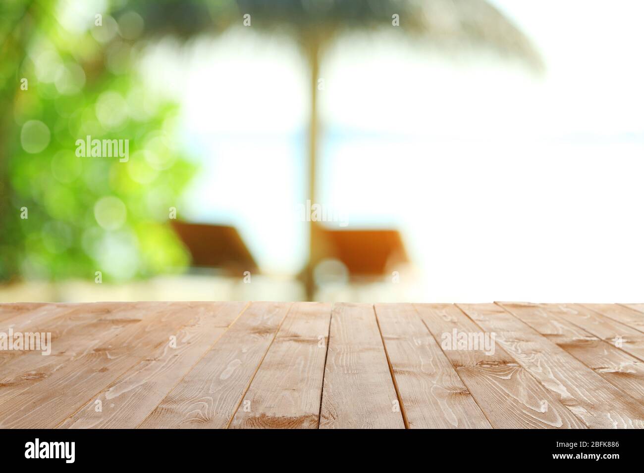 Wooden table with abstract blur background Stock Photo - Alamy