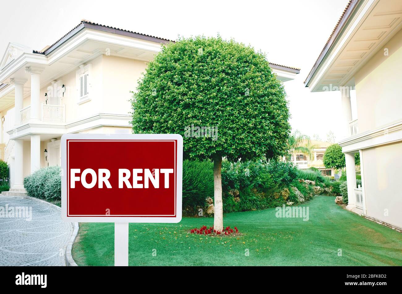 Real estate sign in front of new house for rent Stock Photo - Alamy