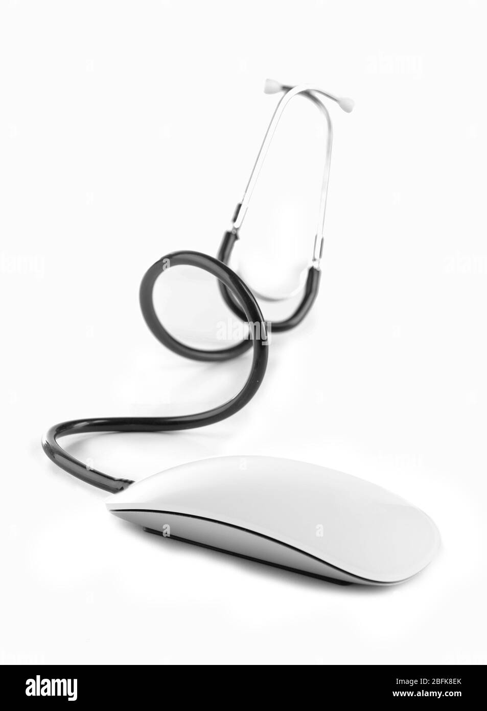 Stethoscope with computer mouse isolated on white. Medical online ...