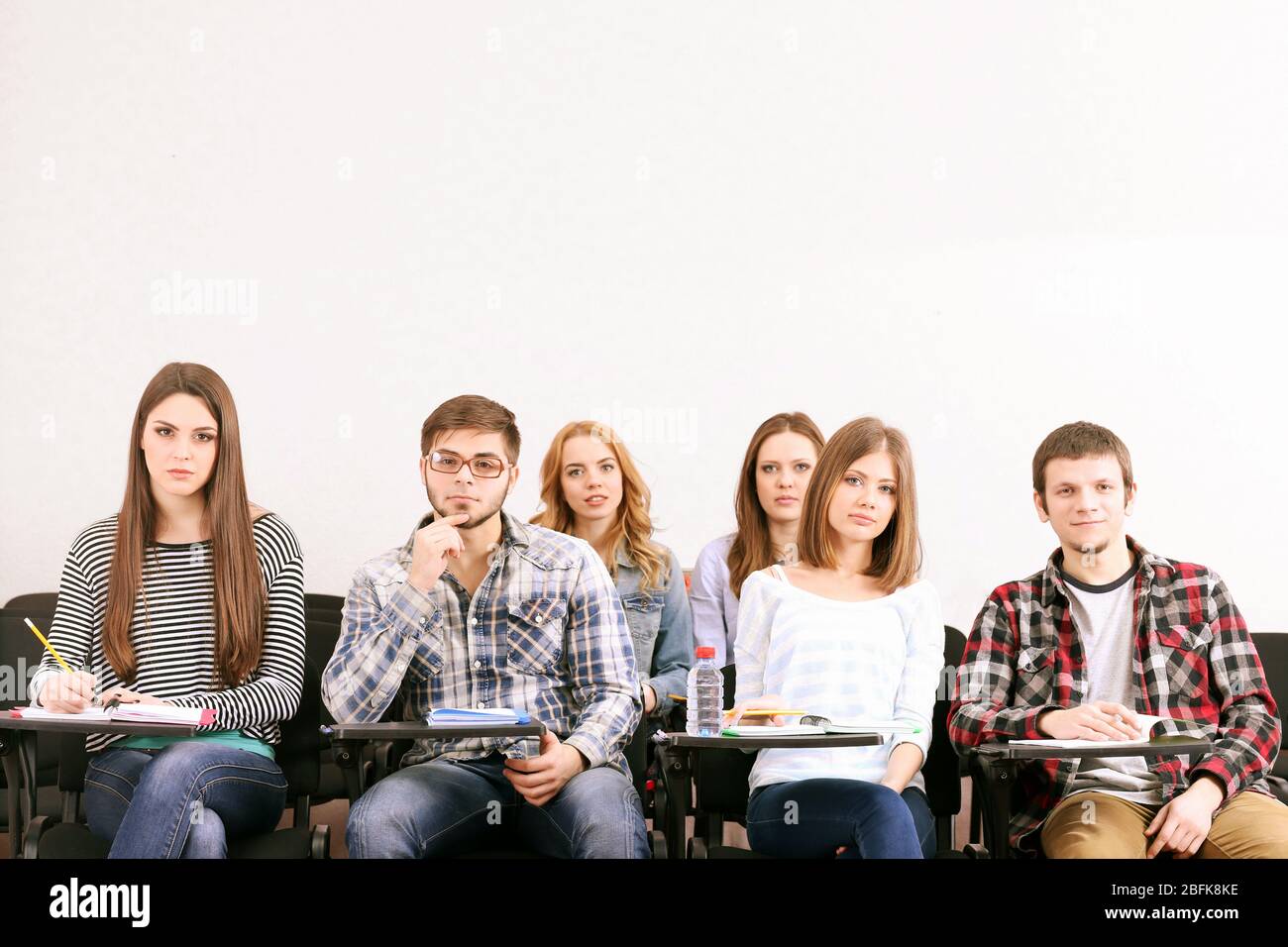 Group of students sitting in classroom Stock Photo - Alamy