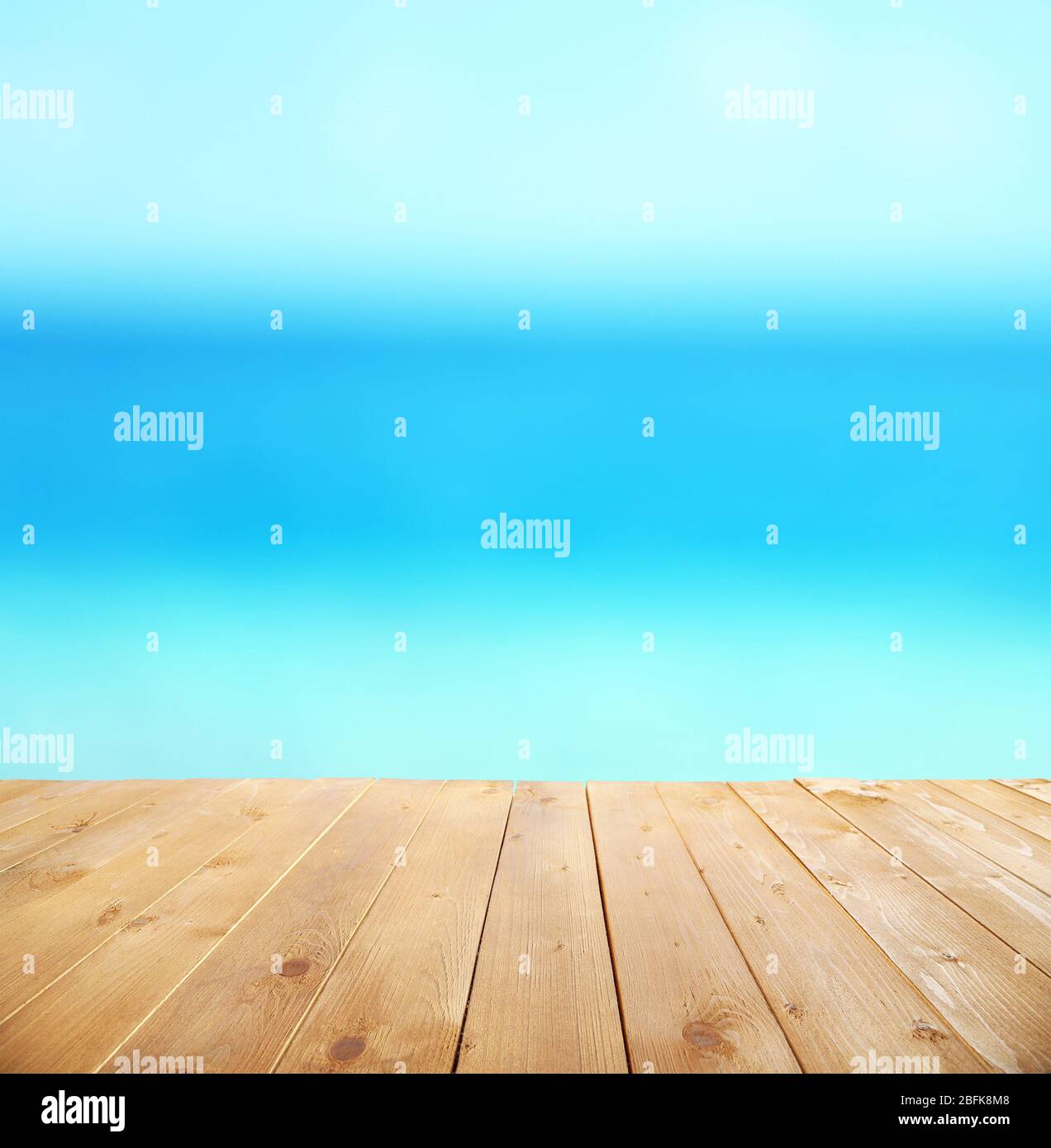 Wooden table with abstract blur background Stock Photo - Alamy