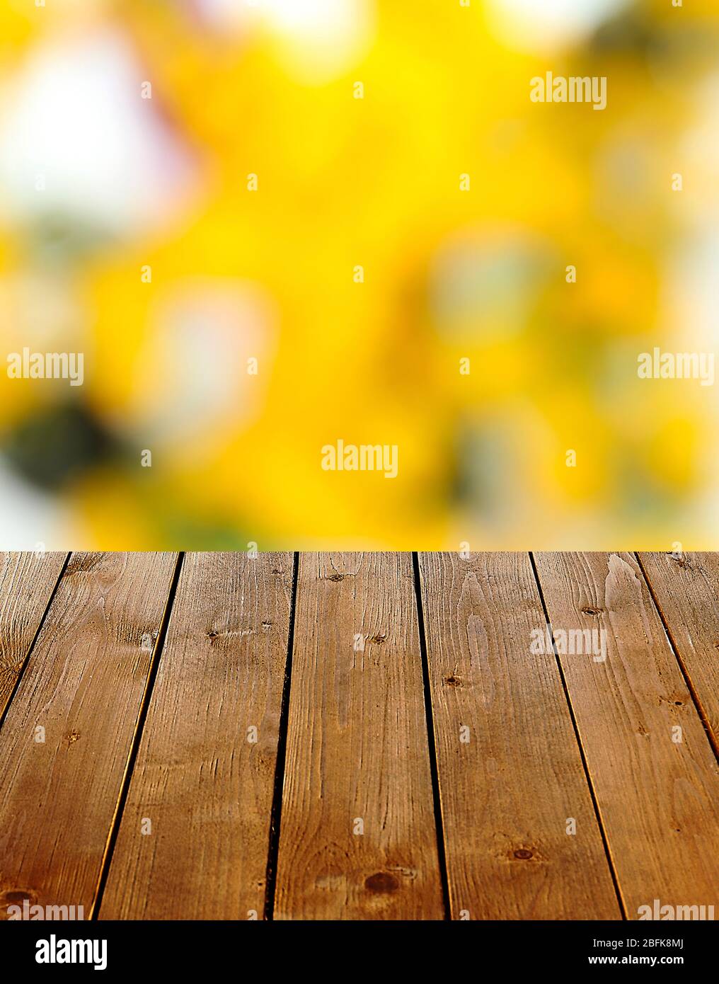 Wooden table with abstract blur background Stock Photo - Alamy