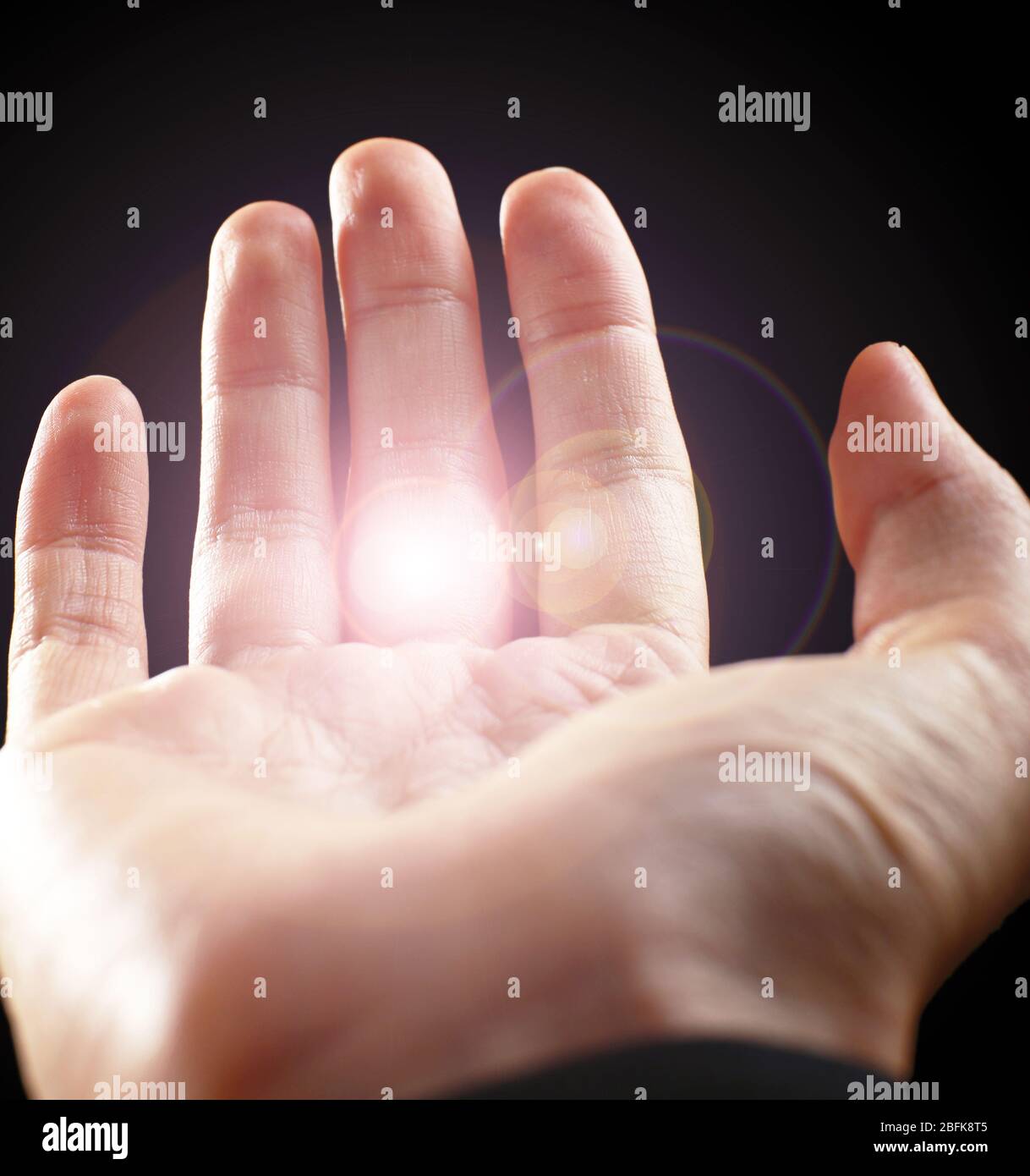 The light in young woman hand Stock Photo - Alamy
