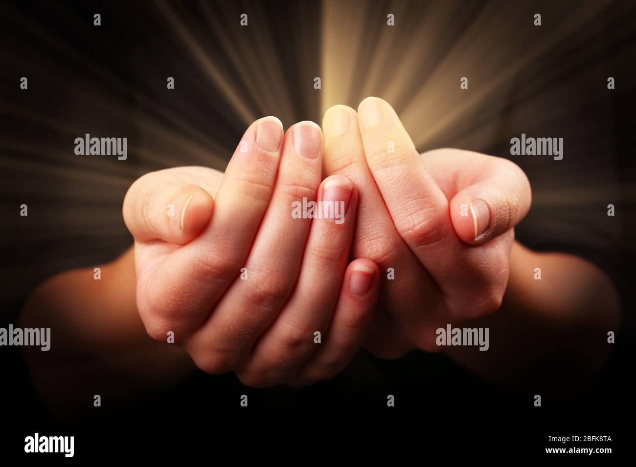 The light in young woman hands Stock Photo - Alamy