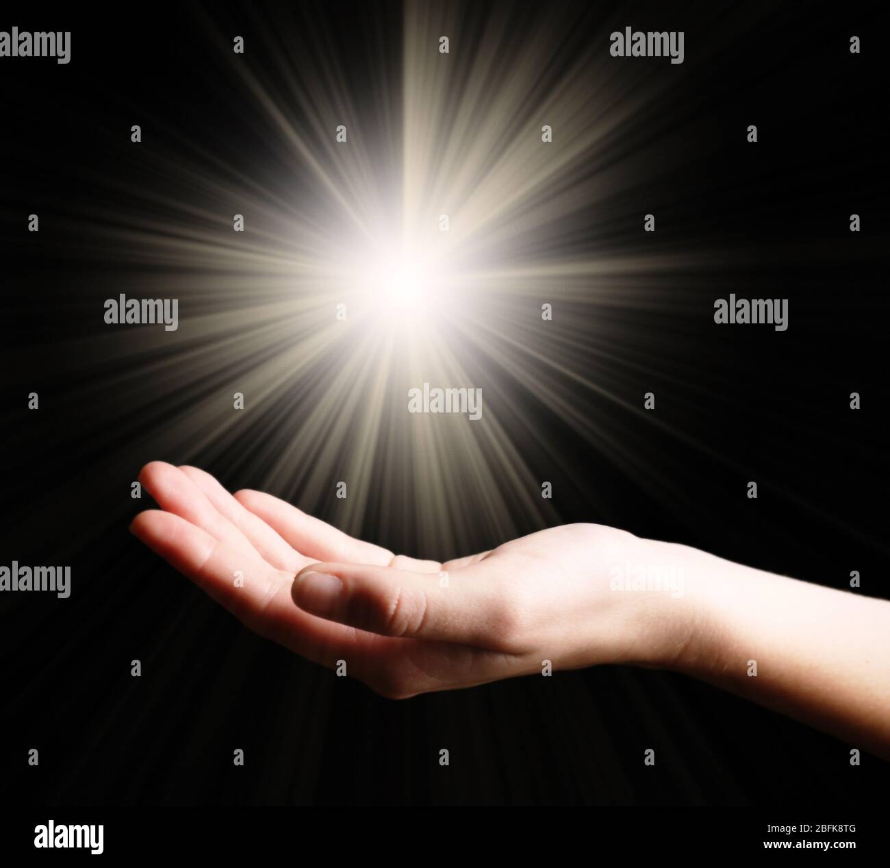 The light in young woman hand Stock Photo - Alamy