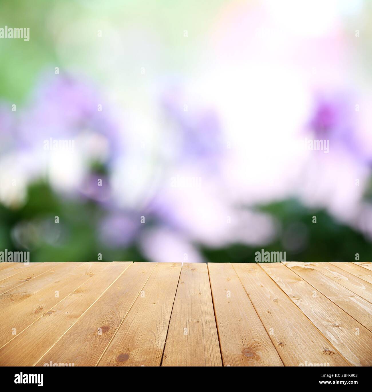 Wooden table with abstract blur background Stock Photo - Alamy