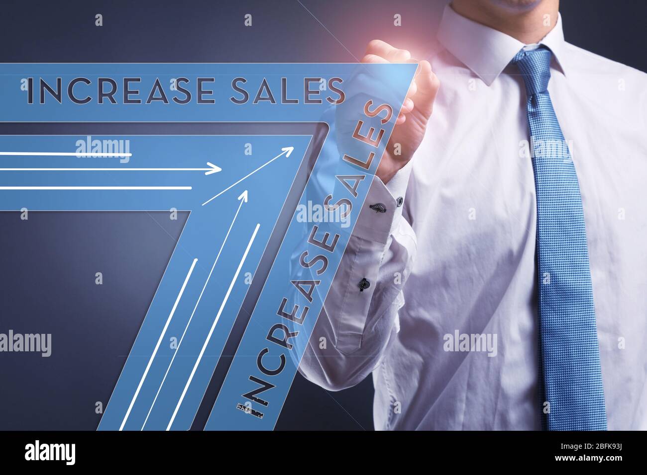 Increase sales concept. businessman drawing on screen Stock Photo - Alamy