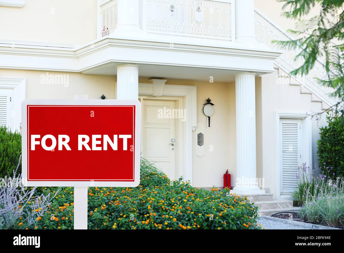 Real estate sign in front of new house for rent Stock Photo - Alamy