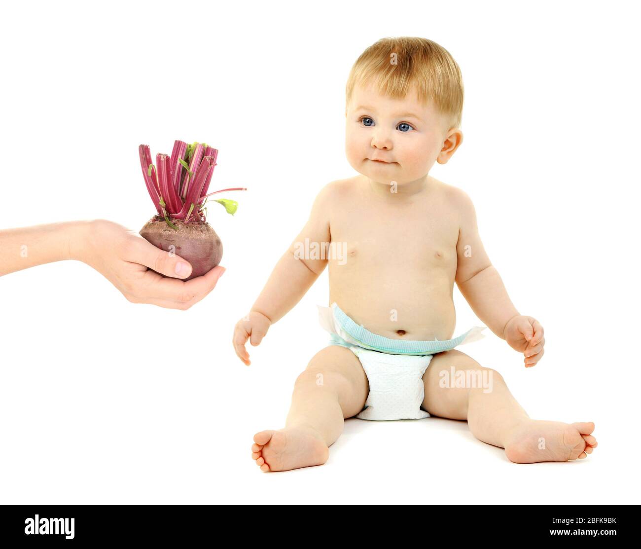 Cute baby boy and hand holding beetroot isolated on white Stock Photo ...