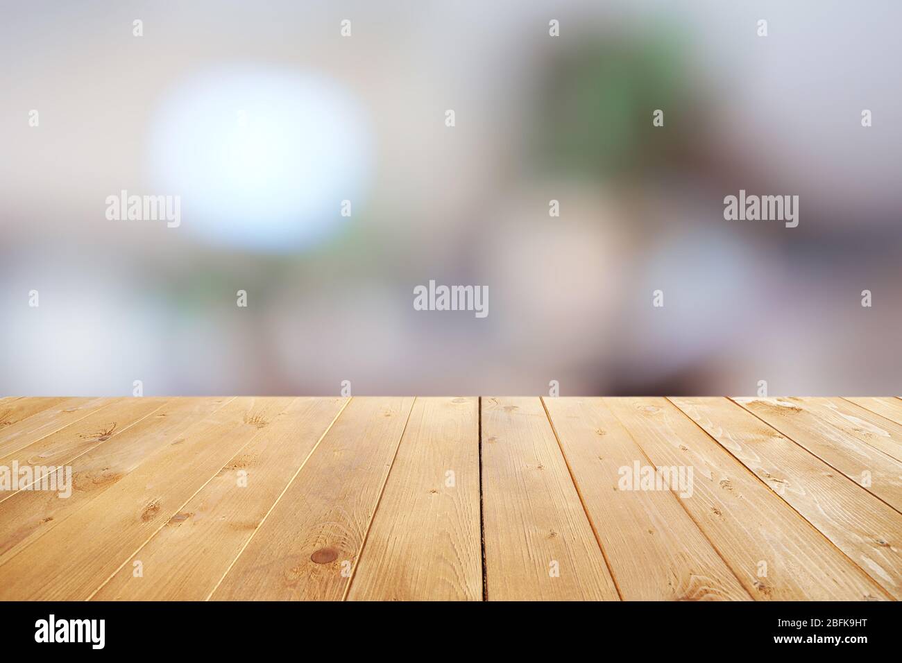 Wooden table with abstract blur background Stock Photo - Alamy
